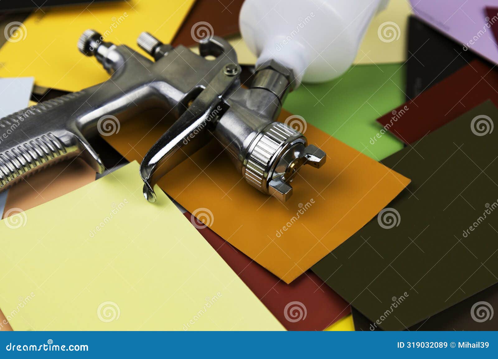 A Paint Spray Gun at Work at the Workplace in the Workshop. Paint ...