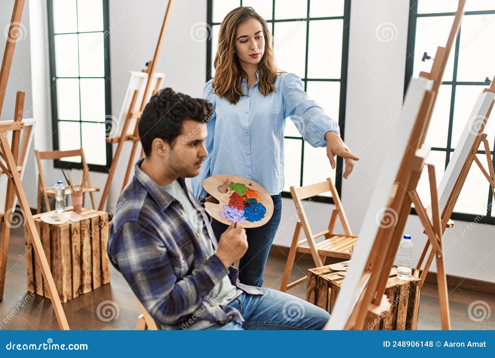 Paint Teacher Teaching To Student at Art School Stock Photo - Image of ...
