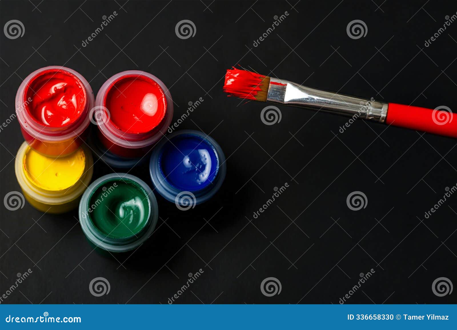 Paint in Various Colours in Jars on a Black Background Stock ...