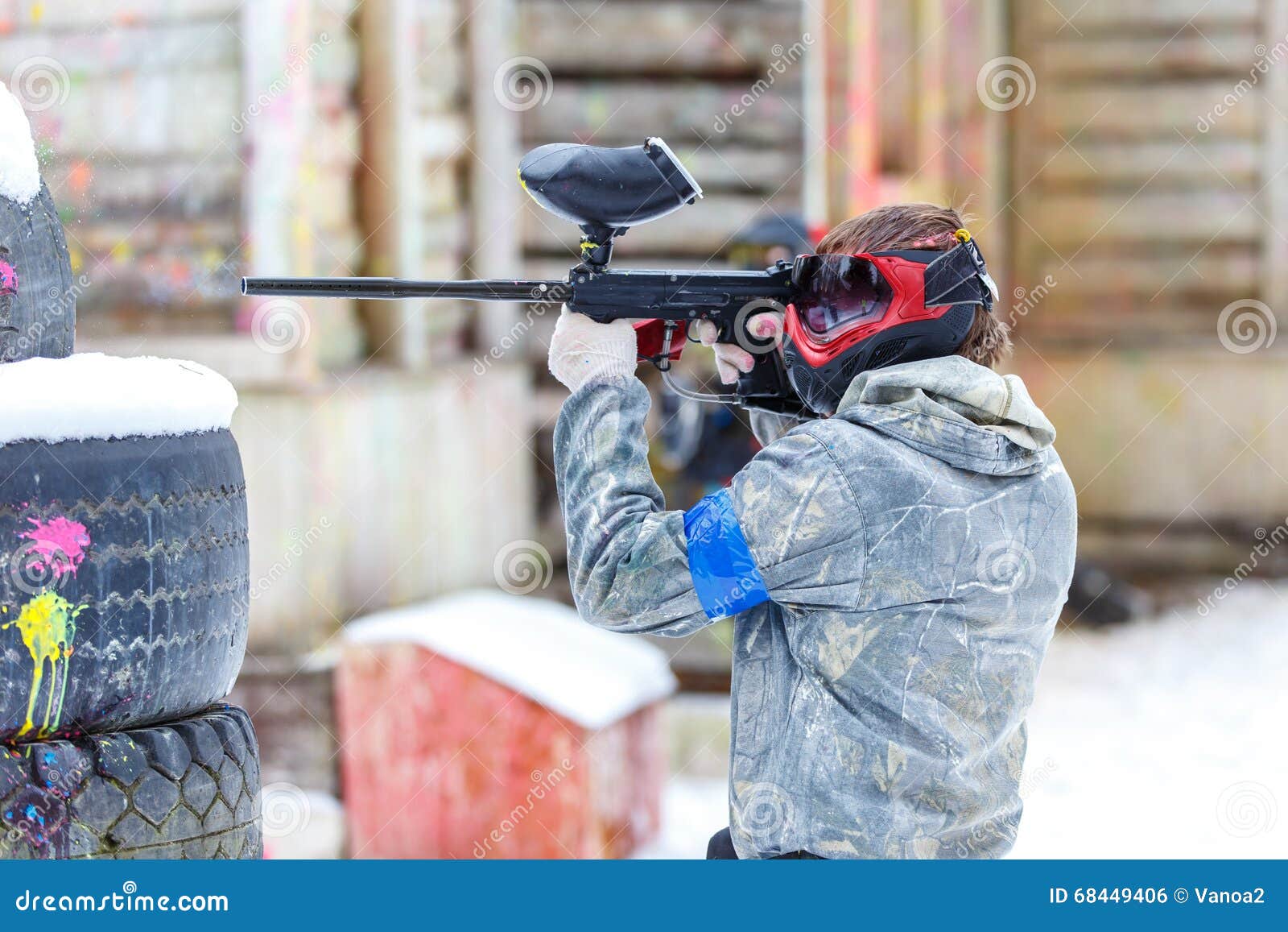 Paintball Game in Winter. Man Shooting from Marker. Stock Photo - Image ...
