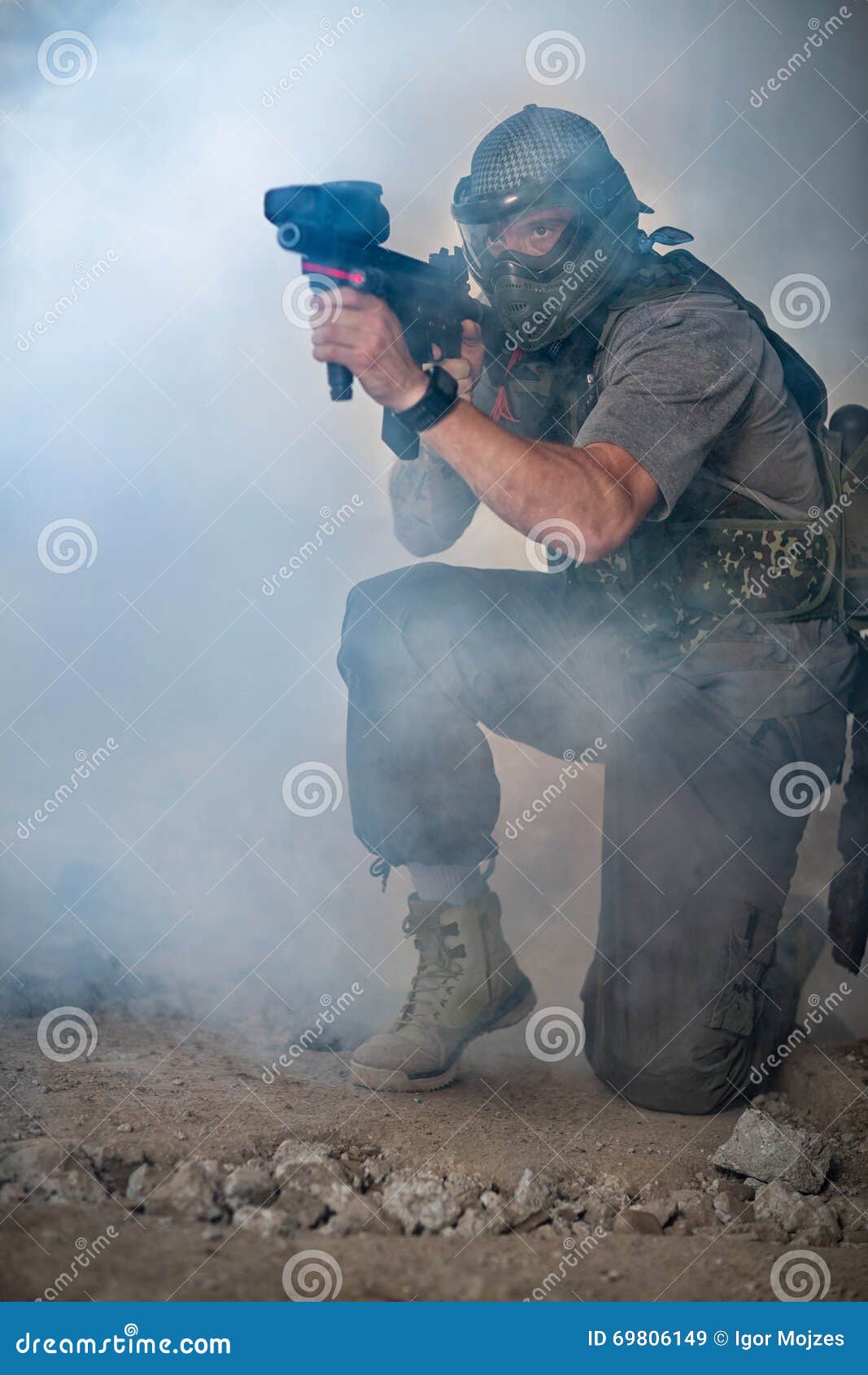 Paintball player with gun stock image. Image of paintballer - 69806149
