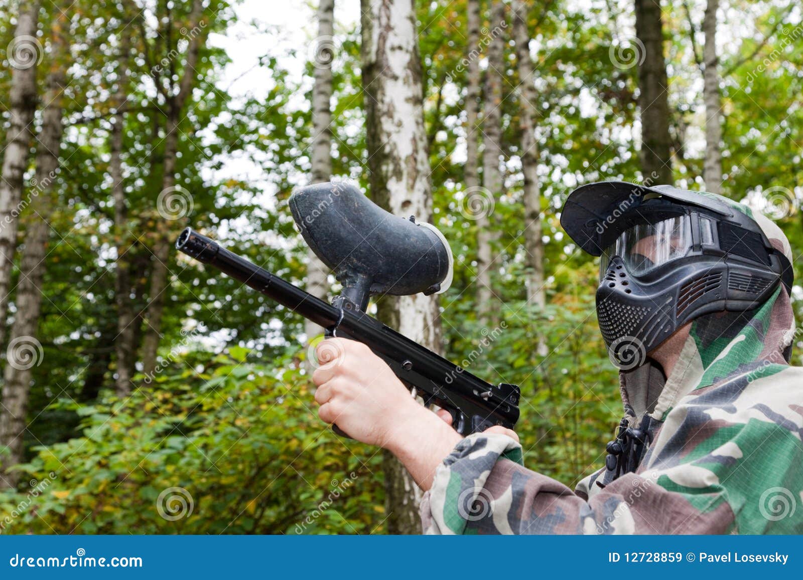 Paintball Player Shoots Aside in Forest Stock Image - Image of mask ...