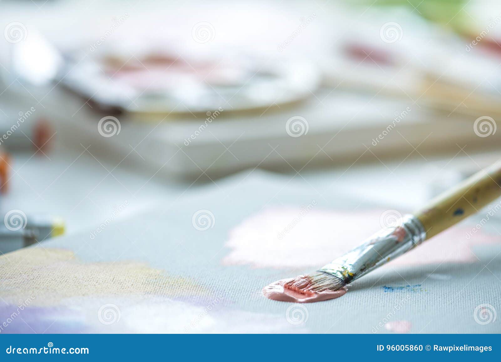 Paintbrush with Colour on a Canvas Painting Stock Photo - Image of ...