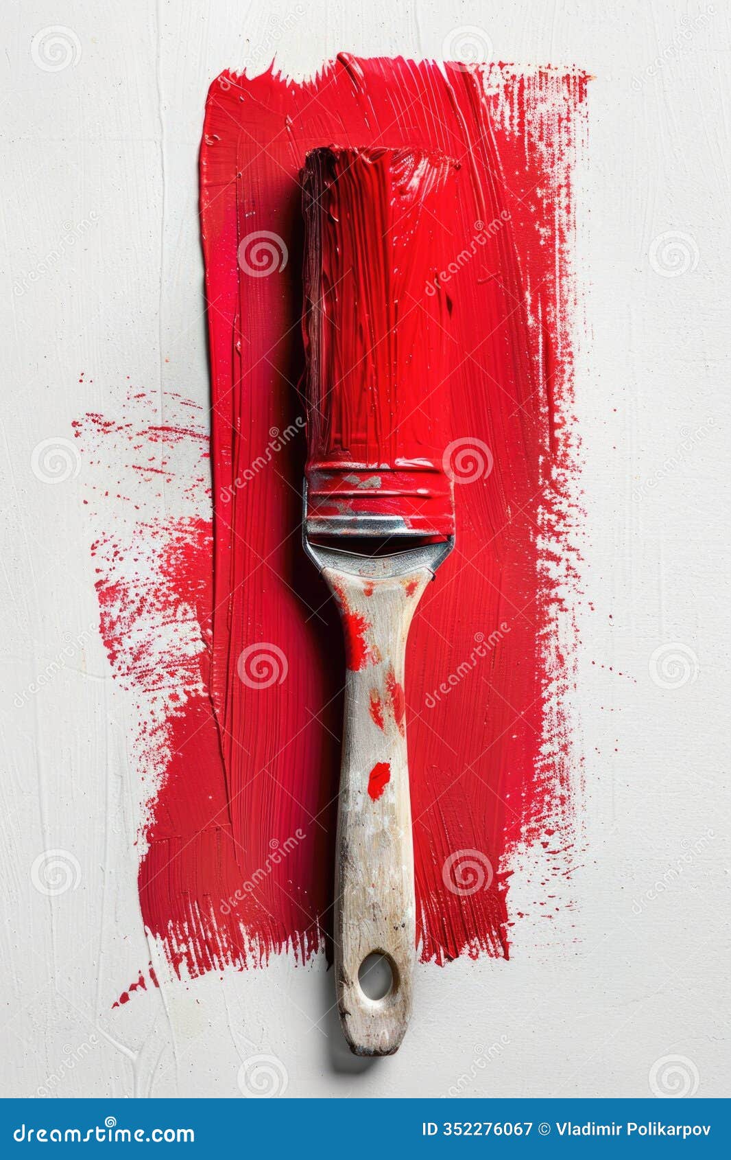 A Paintbrush with Red Paint on a White Wall. Perfect for Interior ...