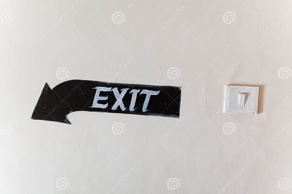 Painted exit sign on wall stock image. Image of directional - 51485261