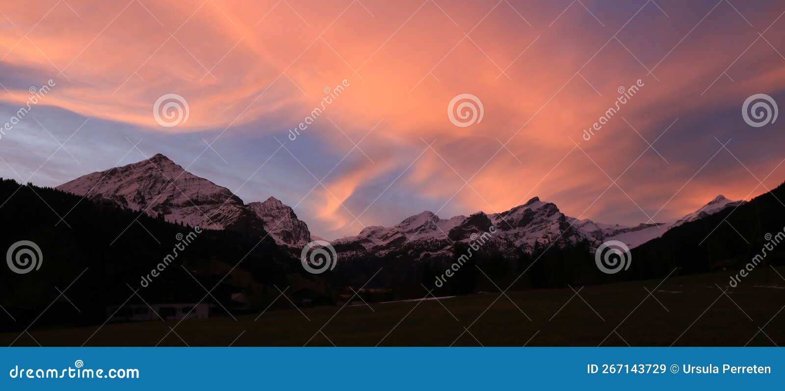 Painted Morning Sky Over a Mountain Range in Gsteig Bei Gstaad Stock ...