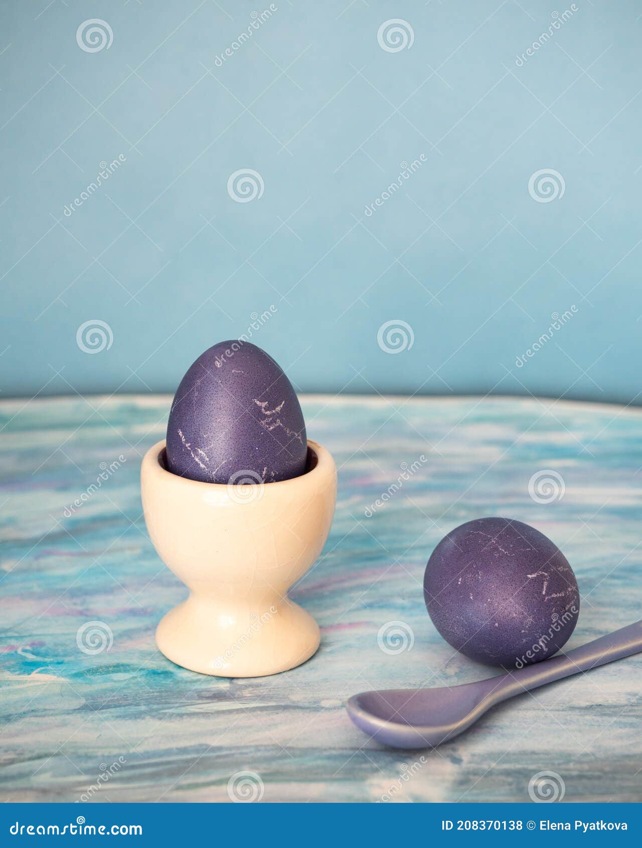 Painted Purple Eggs on a Stand on a Blue Background Stock Photo - Image ...