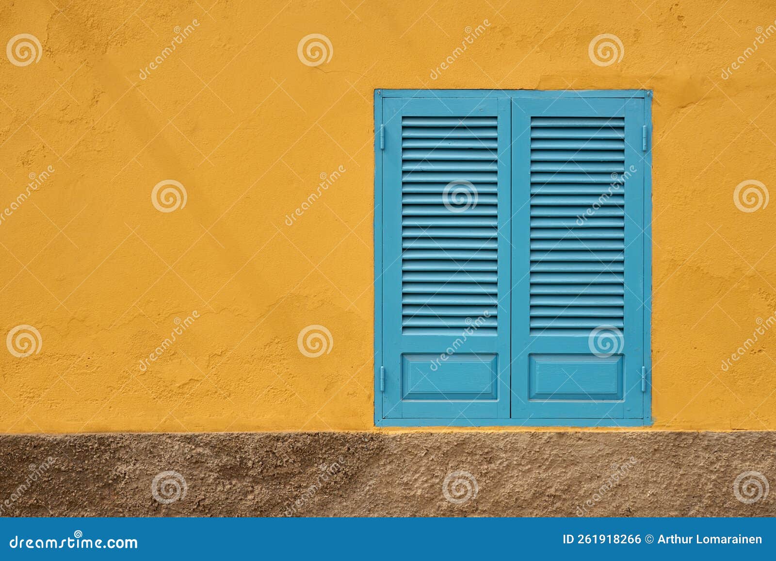 A Painted Yellow Wall with a Blue Window. Stock Photo - Image of show ...