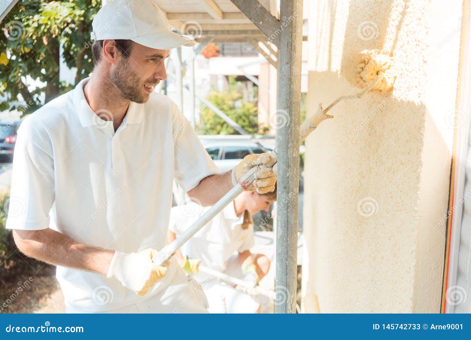 Painter on Construction Site Painting Wall Yellow Stock Image - Image ...