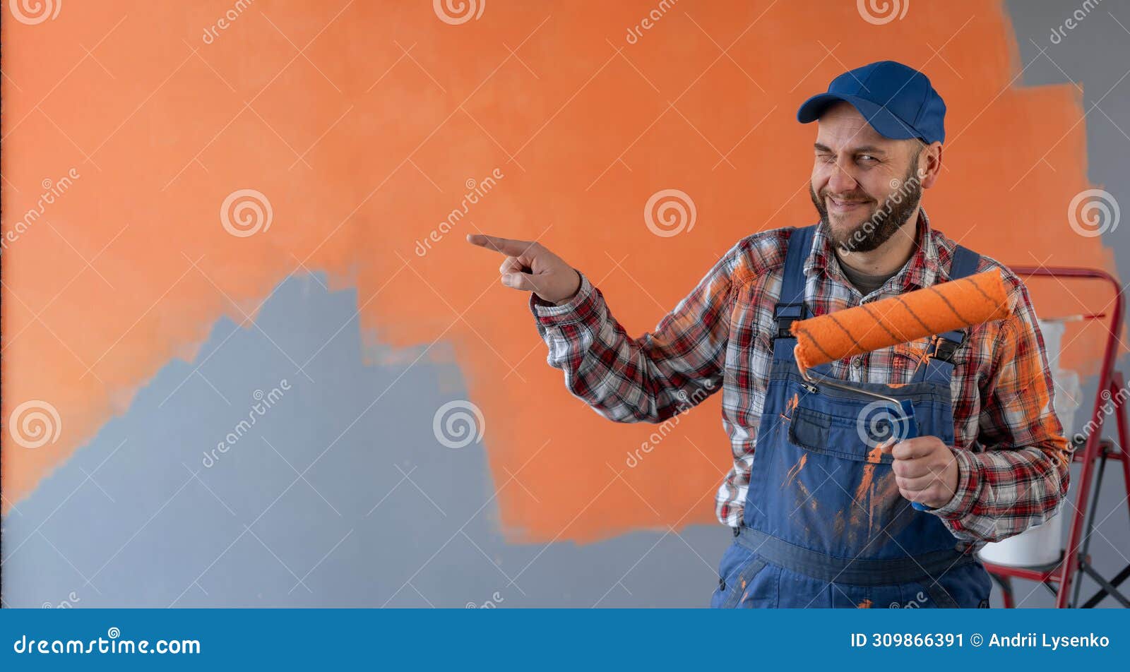Painter or Decorator Man Holding Roller with a Smile on His Face ...