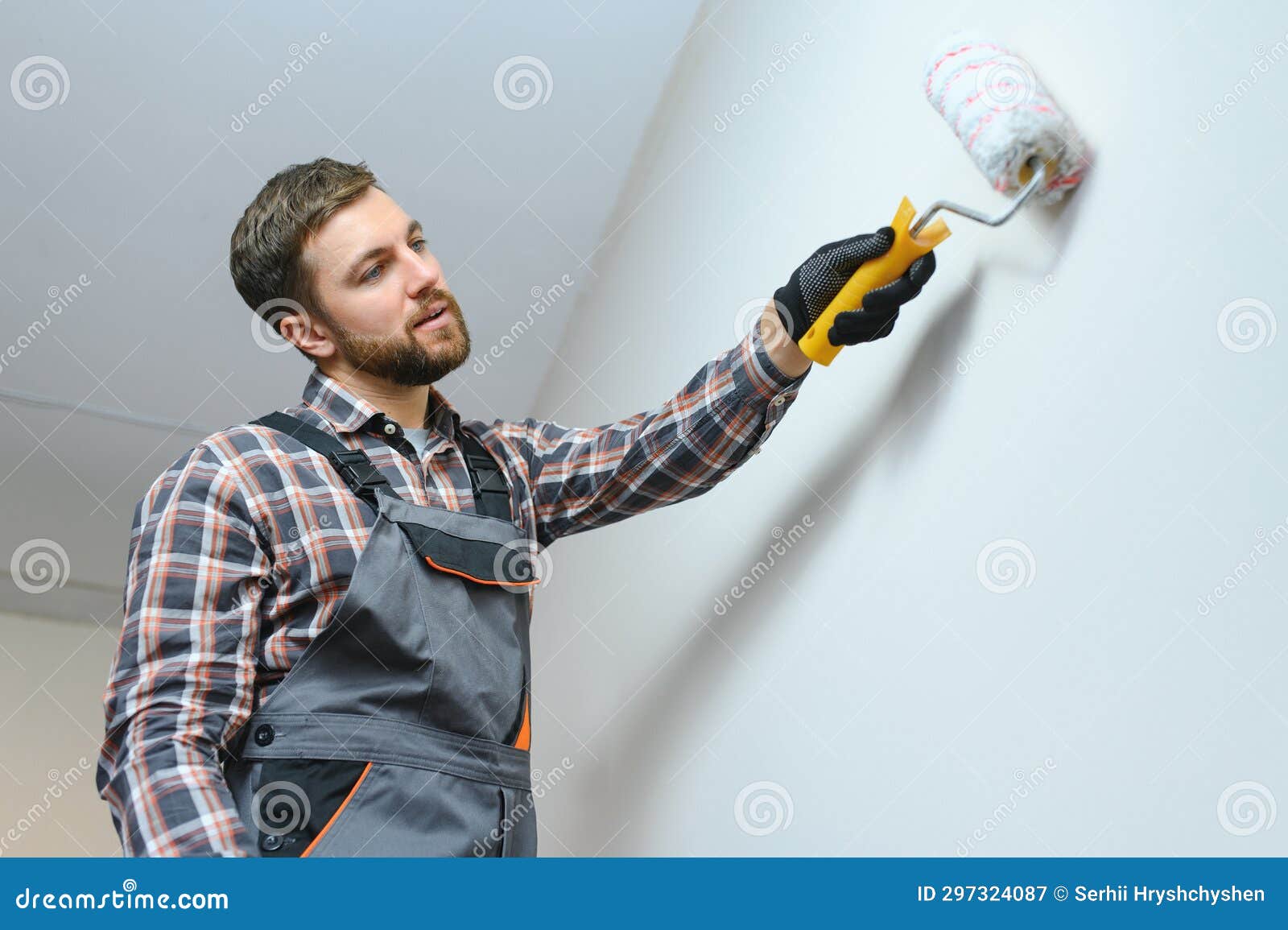 Painter Man Painting the Wall, with Paint Roller Stock Image - Image of ...