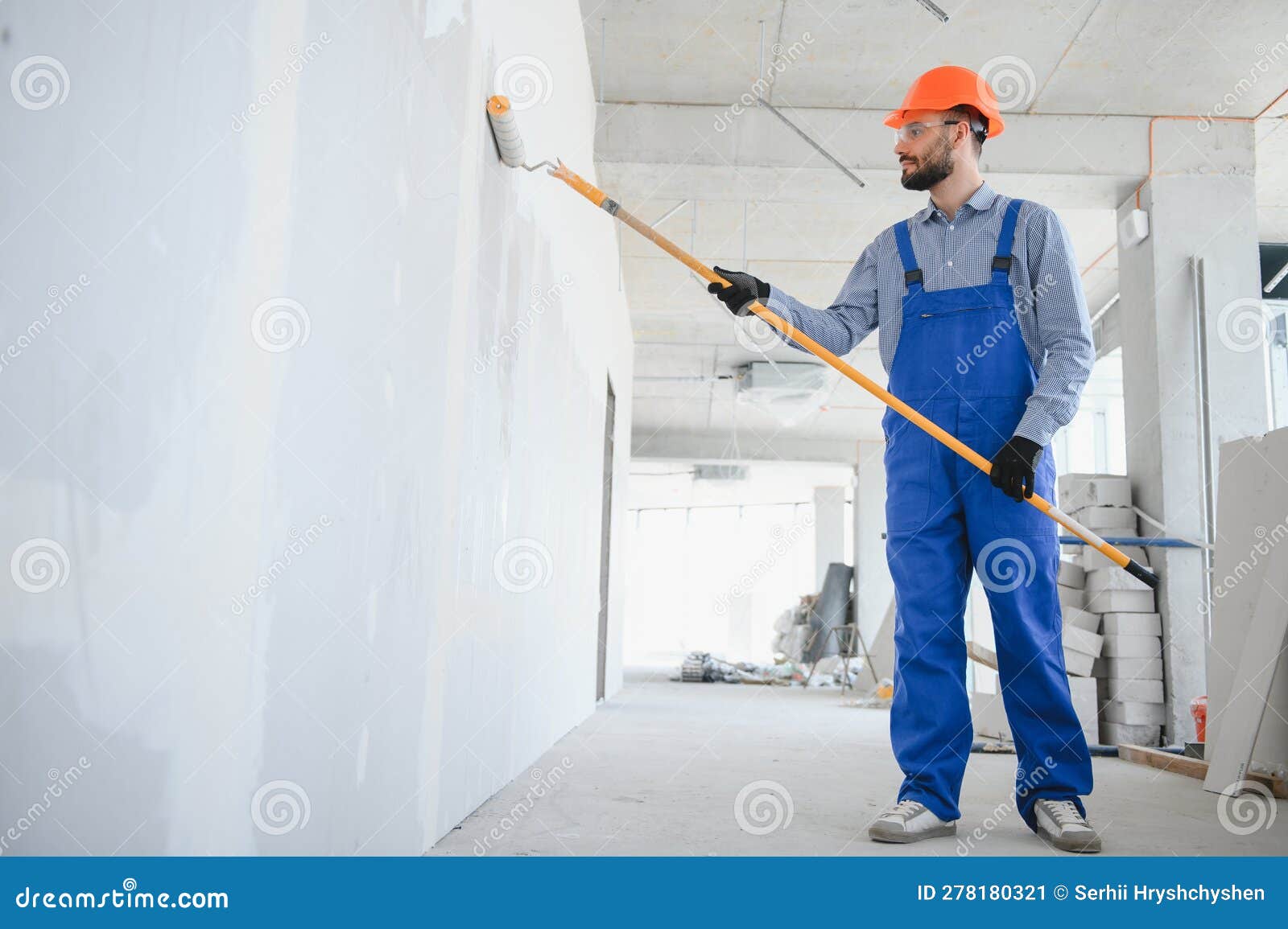Painter Man Painting the Wall, with Paint Roller Stock Image - Image of ...