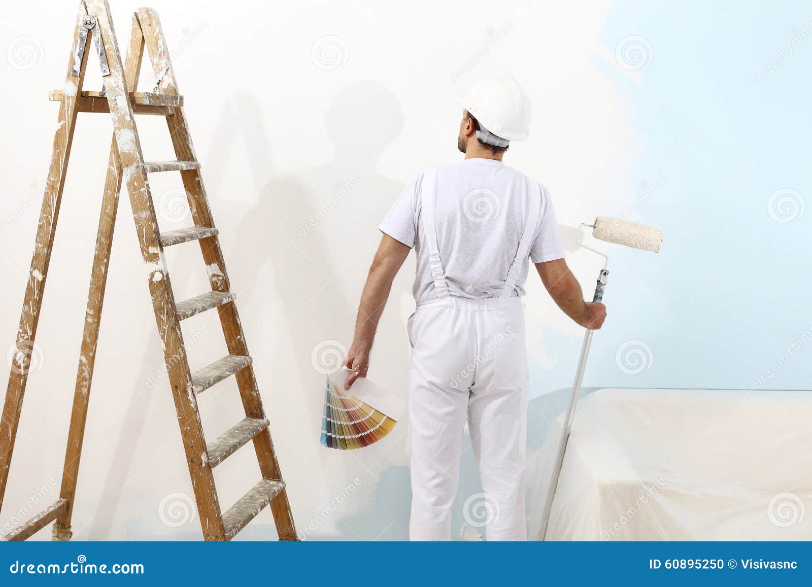 Painter Man at Work with a Paint Roller and Color Samples Stock Photo ...