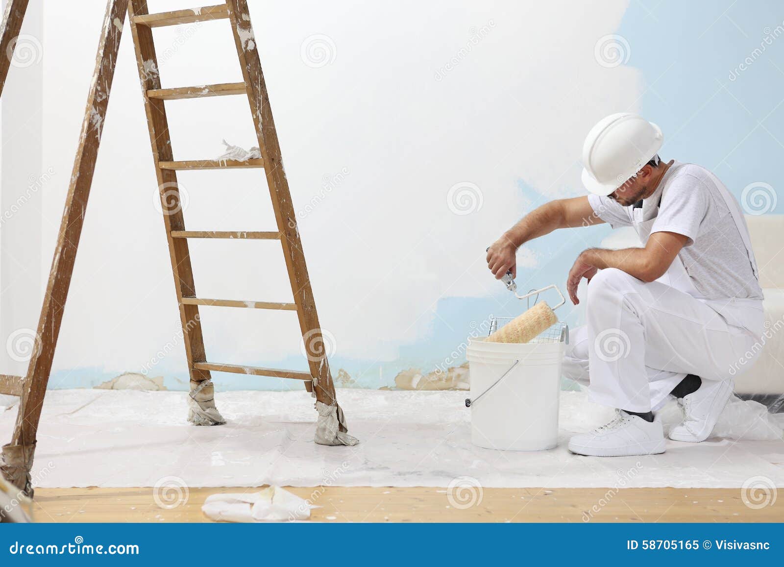 Painter Man at Work Takes the Color with Paint Roller from the B Stock ...