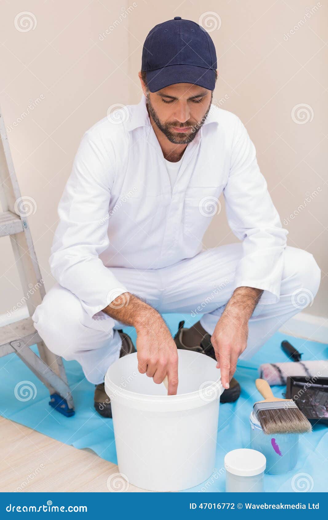 Painter Mixing Paint in a Bucket Stock Photo - Image of male, house ...