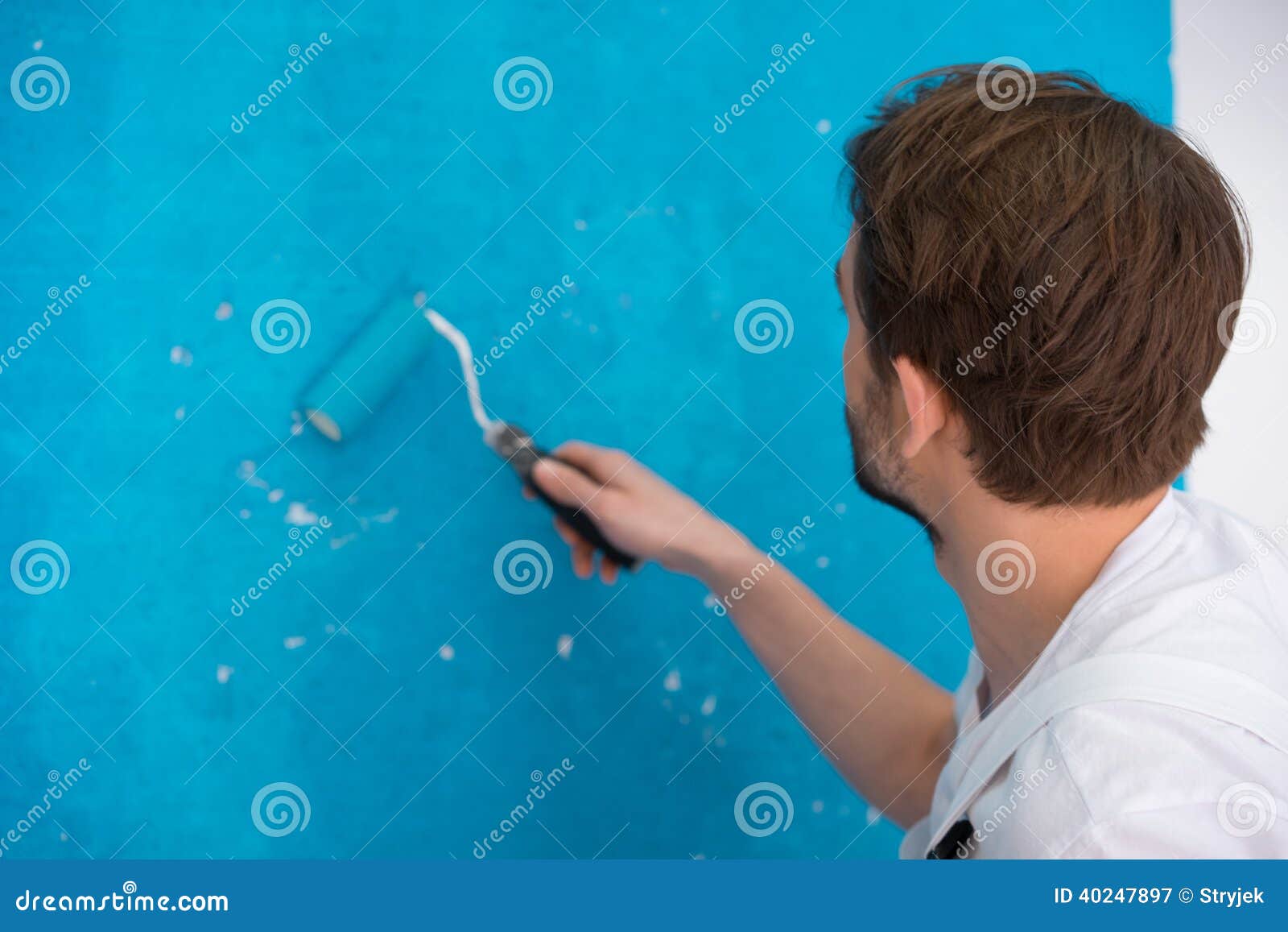 Painter painting wall stock image. Image of dungarees - 40247897