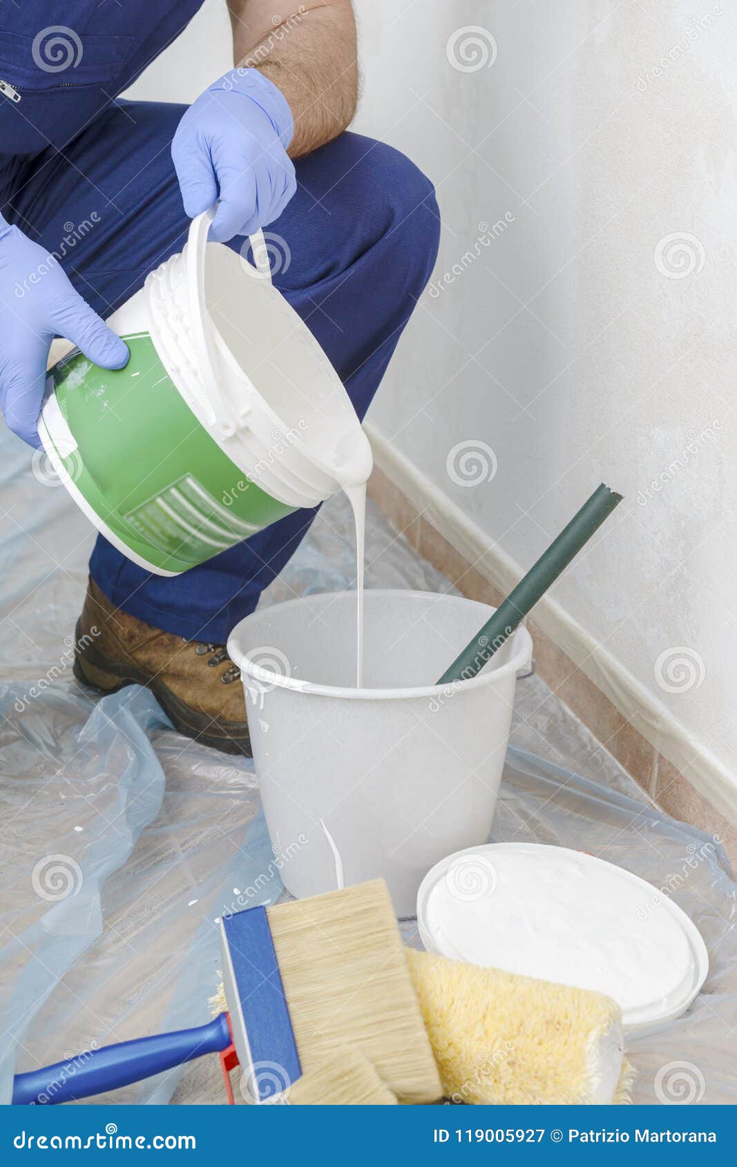 Painter Paints the Wall with the Tint of White. Stock Image - Image of ...
