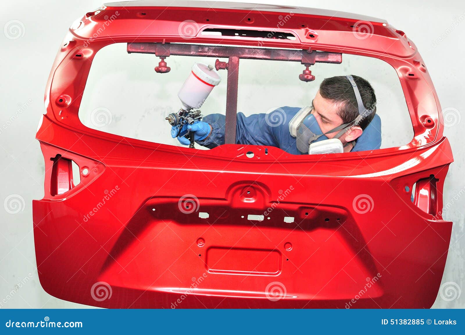 Painter spraying red base. stock image. Image of repair - 51382885