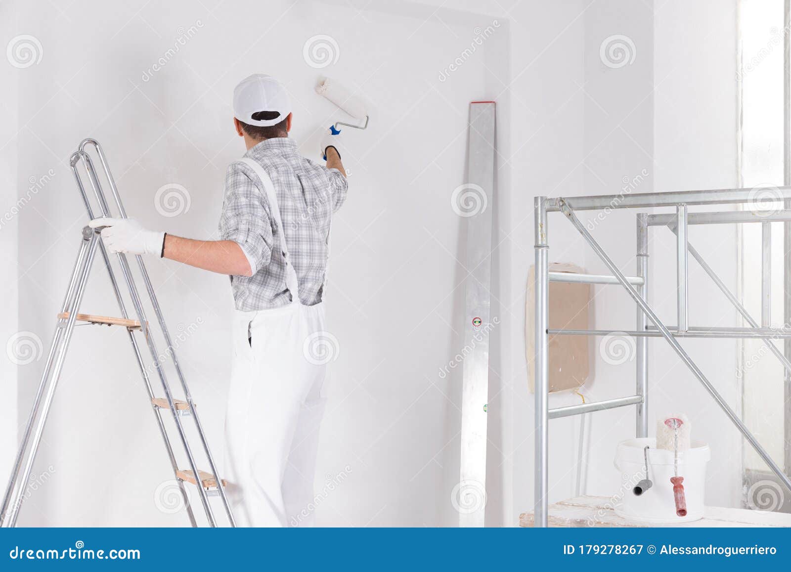Painter Standing on a Ladder Painting a White Wall Stock Image - Image ...