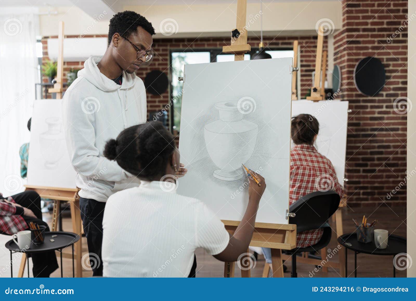 Painter Teacher Explaining Illustration Technique To Student Stock ...