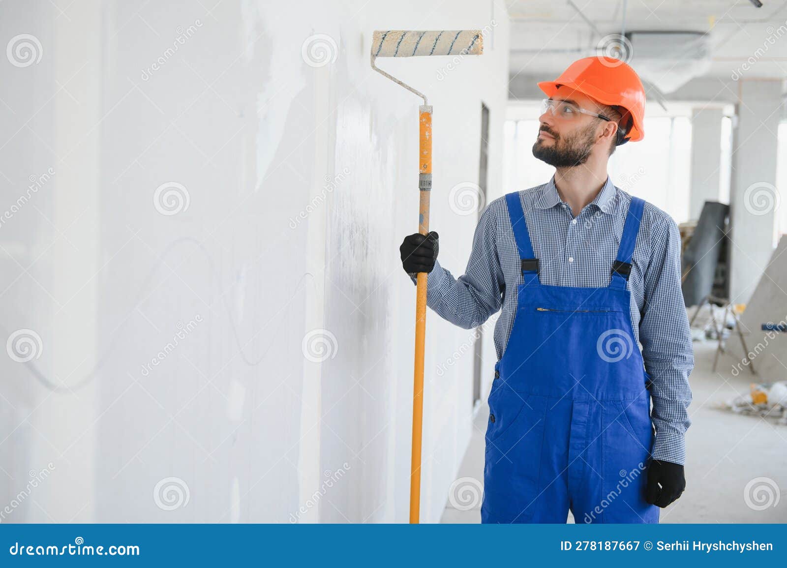 Painter in Uniform Paints the Wall. Stock Image - Image of interior ...