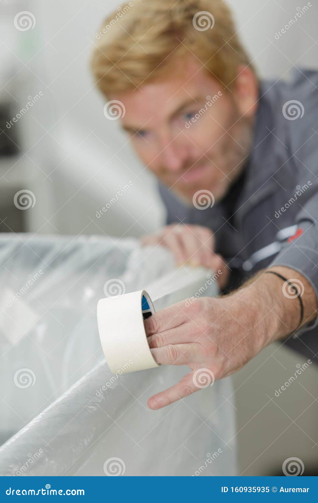 Painter using masking tape stock image. Image of cardboard - 160935935