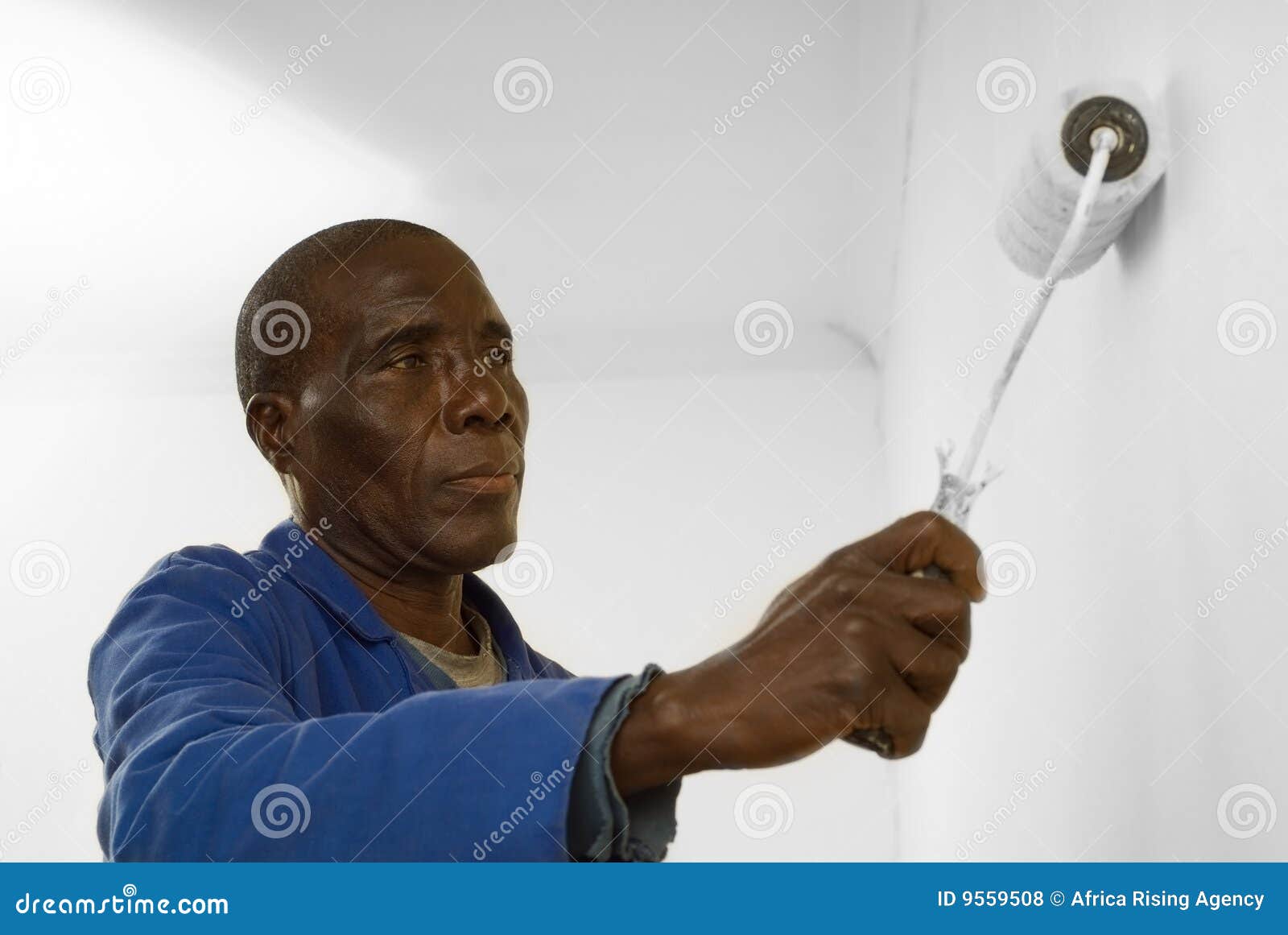 Painter Using a Paint Roller Stock Photo - Image of brush, restore: 9559508
