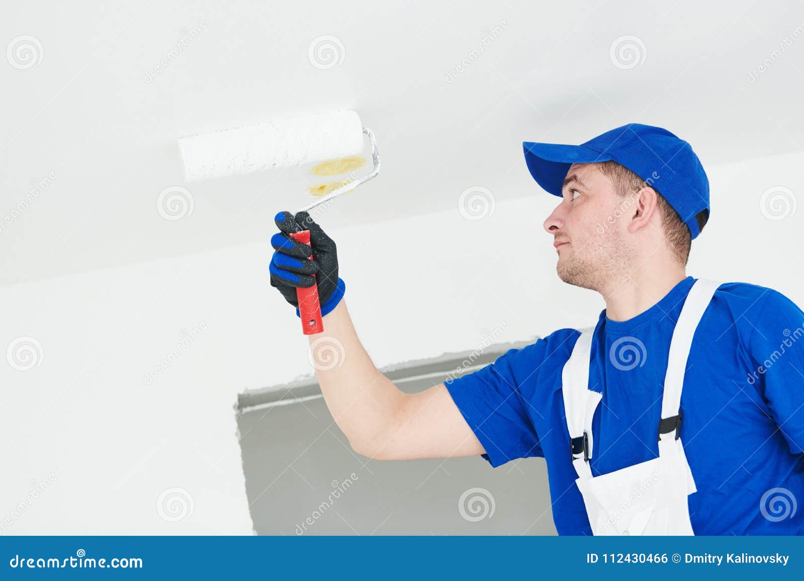 Painter Painting Ceiling with Paint Roller Stock Photo - Image of ...