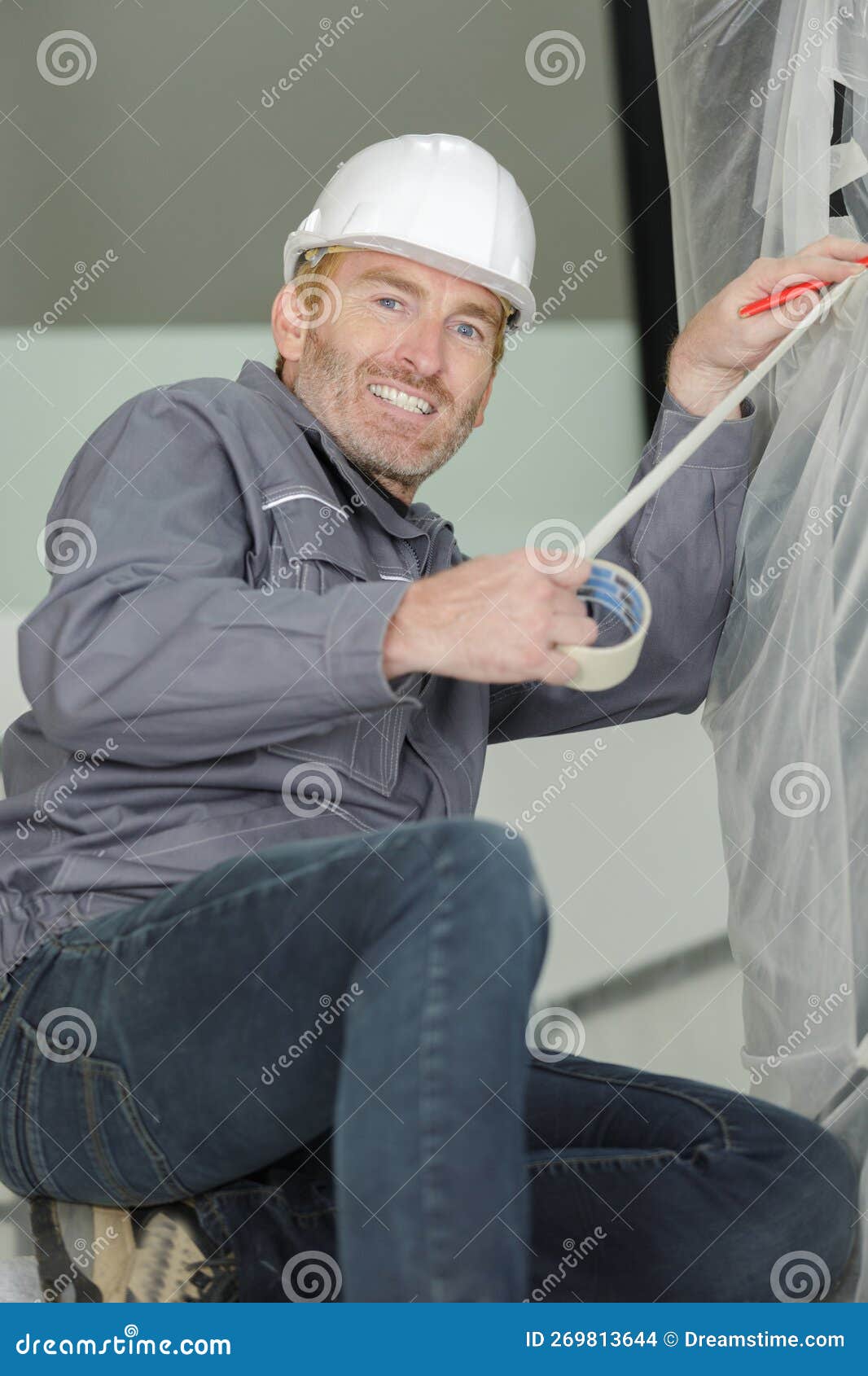 Worker Protecting Countertop In Kitchen With Masking Tape Before ...