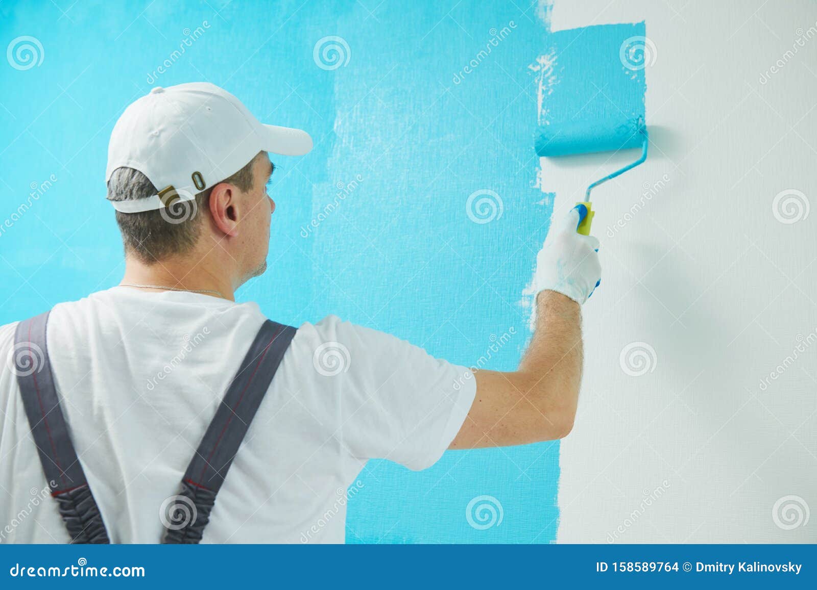 Painter Worker with Roller Painting Wall Surface into Color Stock Photo ...