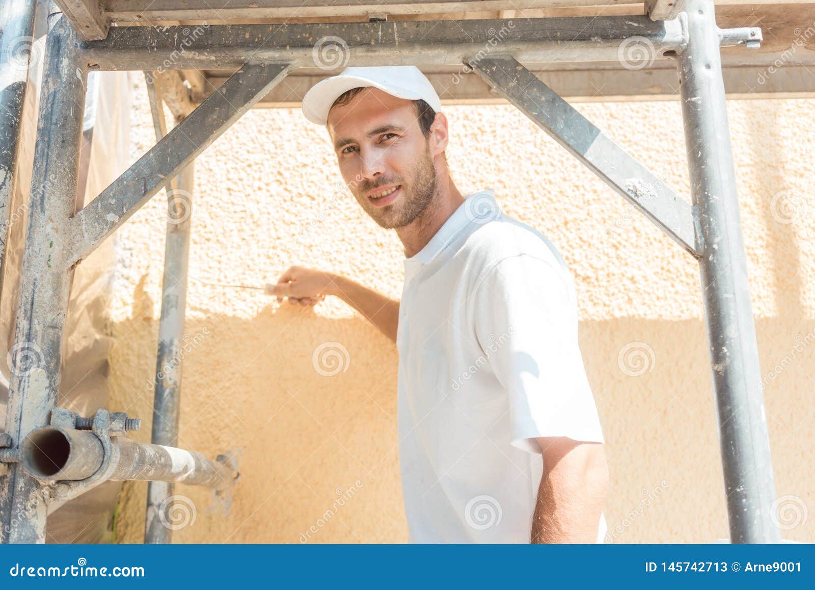 Painter working on a wall stock image. Image of worker - 145742713