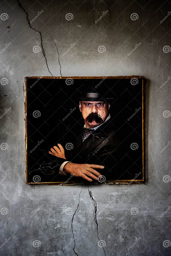 A Painting of a Man with a Mustache Hangs on a Broken Wall Stock Image ...