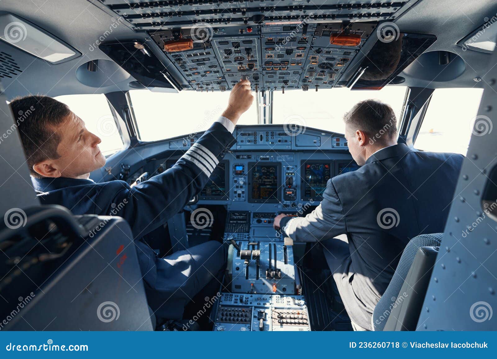Pair of Aircraft Pilots Toggling Switches while Taking-off Stock Photo ...