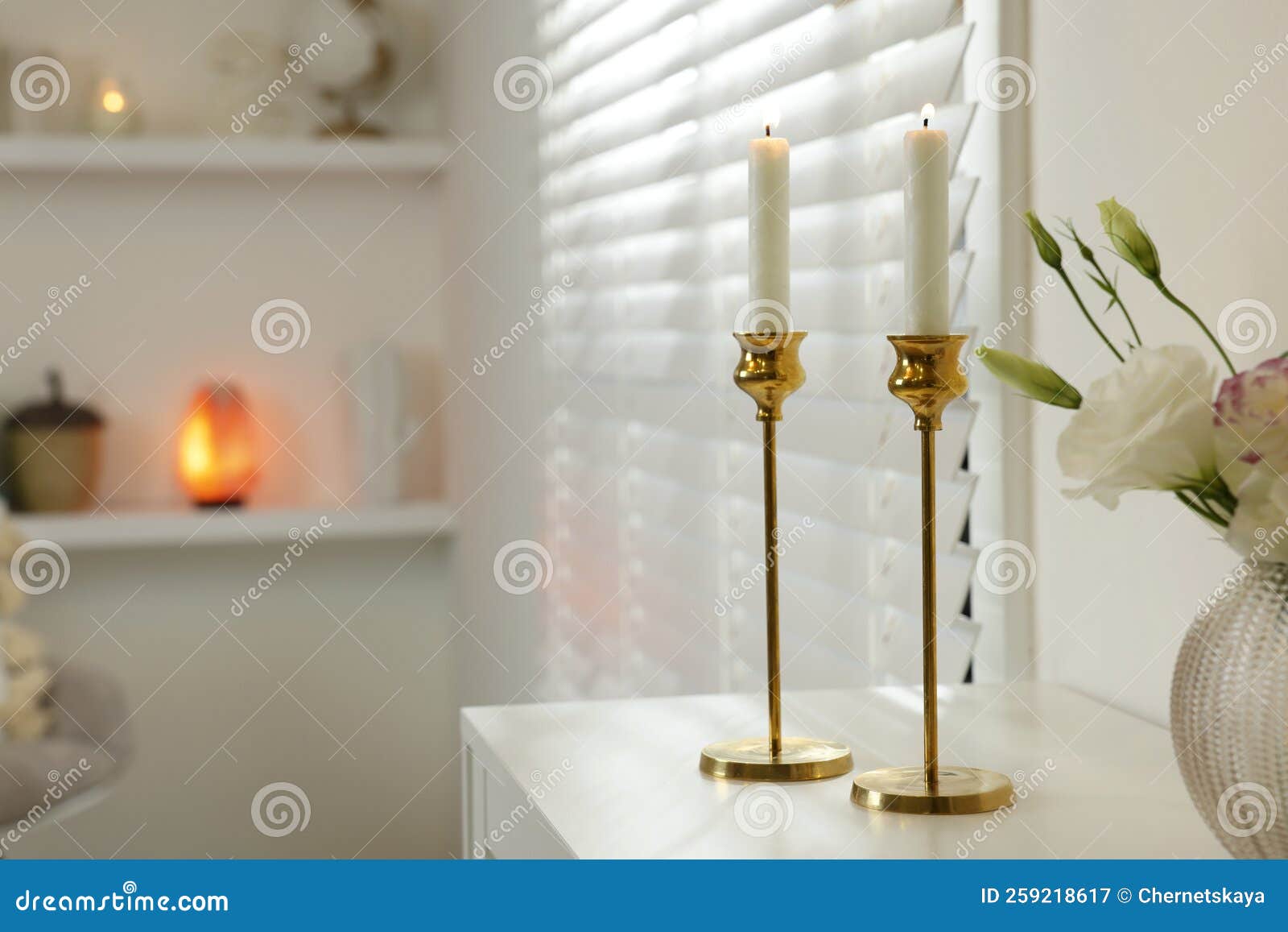 Pair of Beautiful Golden Candlesticks on White Table in Room, Space for ...