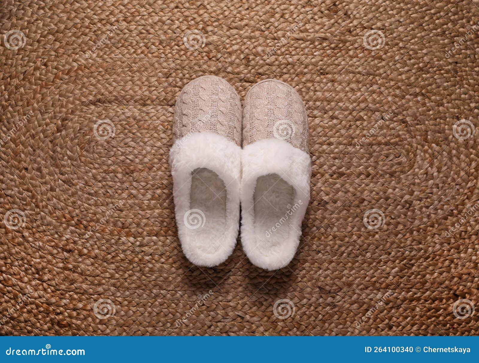 Pair of Beautiful Soft Slippers on Wicker Carpet, Top View Stock Photo ...