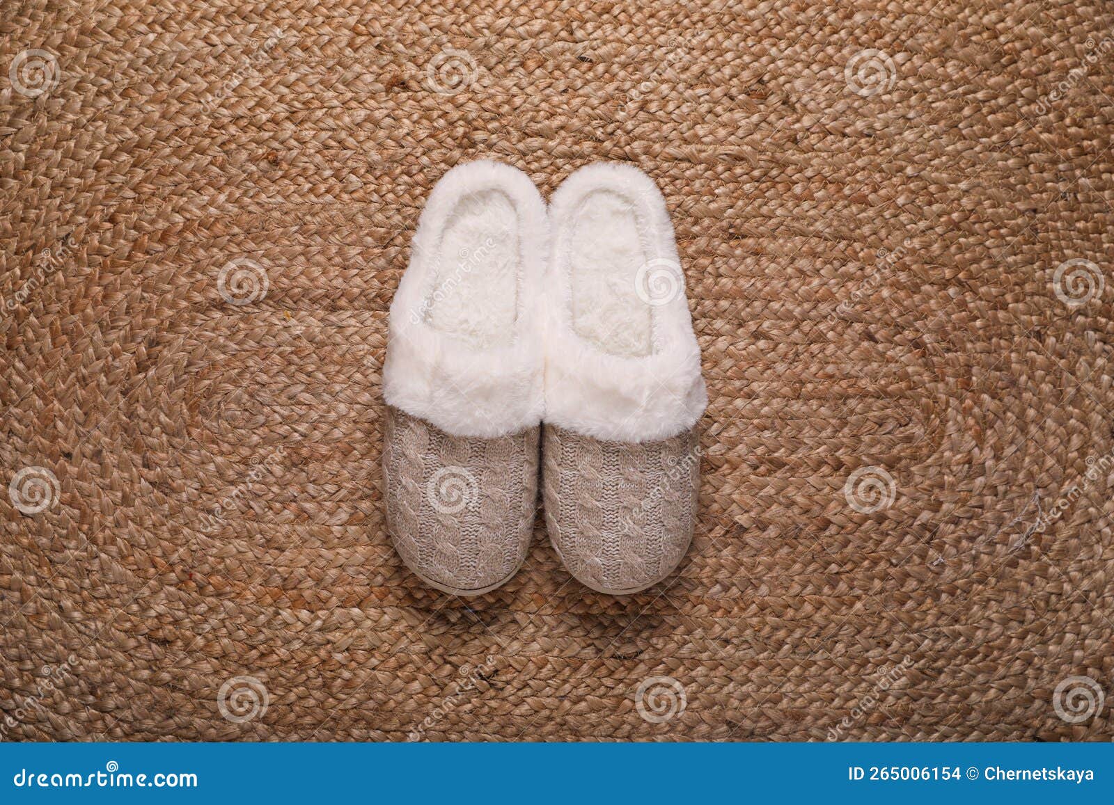 Pair of Beautiful Soft Slippers on Wicker Carpet, Top View Stock Photo ...