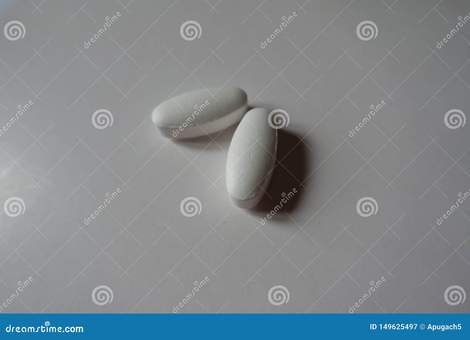 Pair of White Oblong Caplets of Calcium Citrate Stock Image - Image of ...