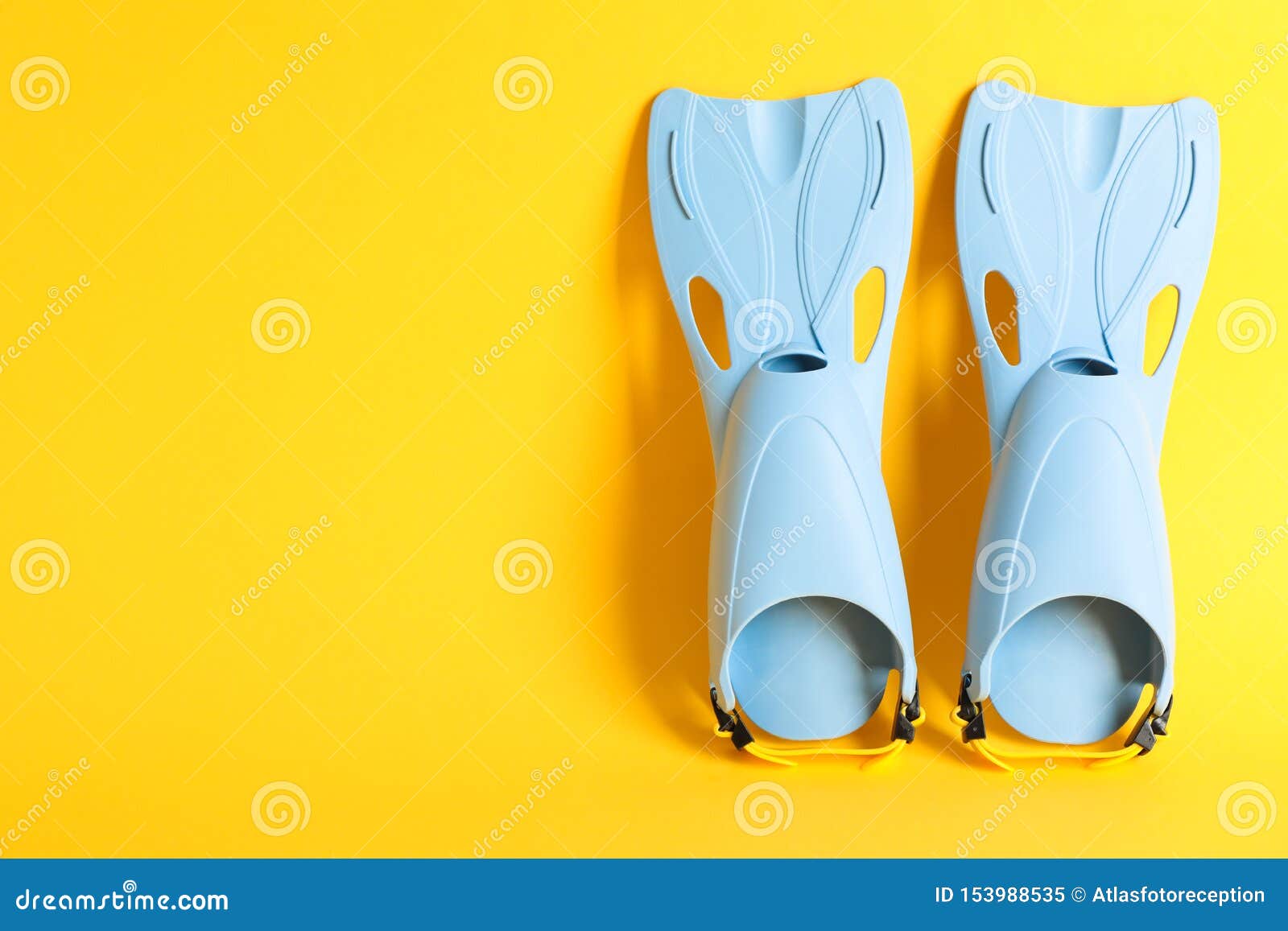 Pair of Blue Flippers on Yellow Background Stock Image - Image of ...
