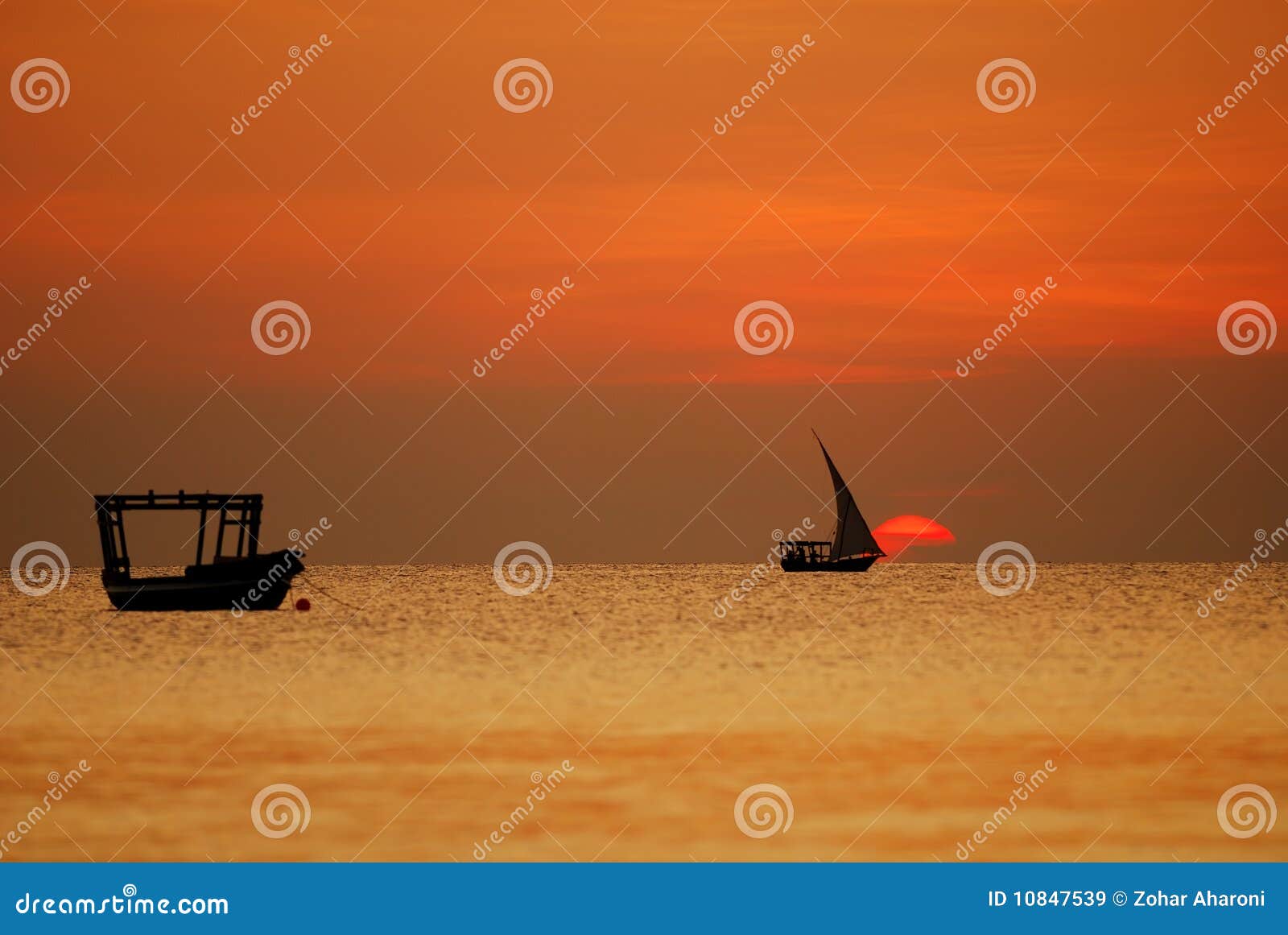 Pair of boats in sunset stock image. Image of clouds - 10847539