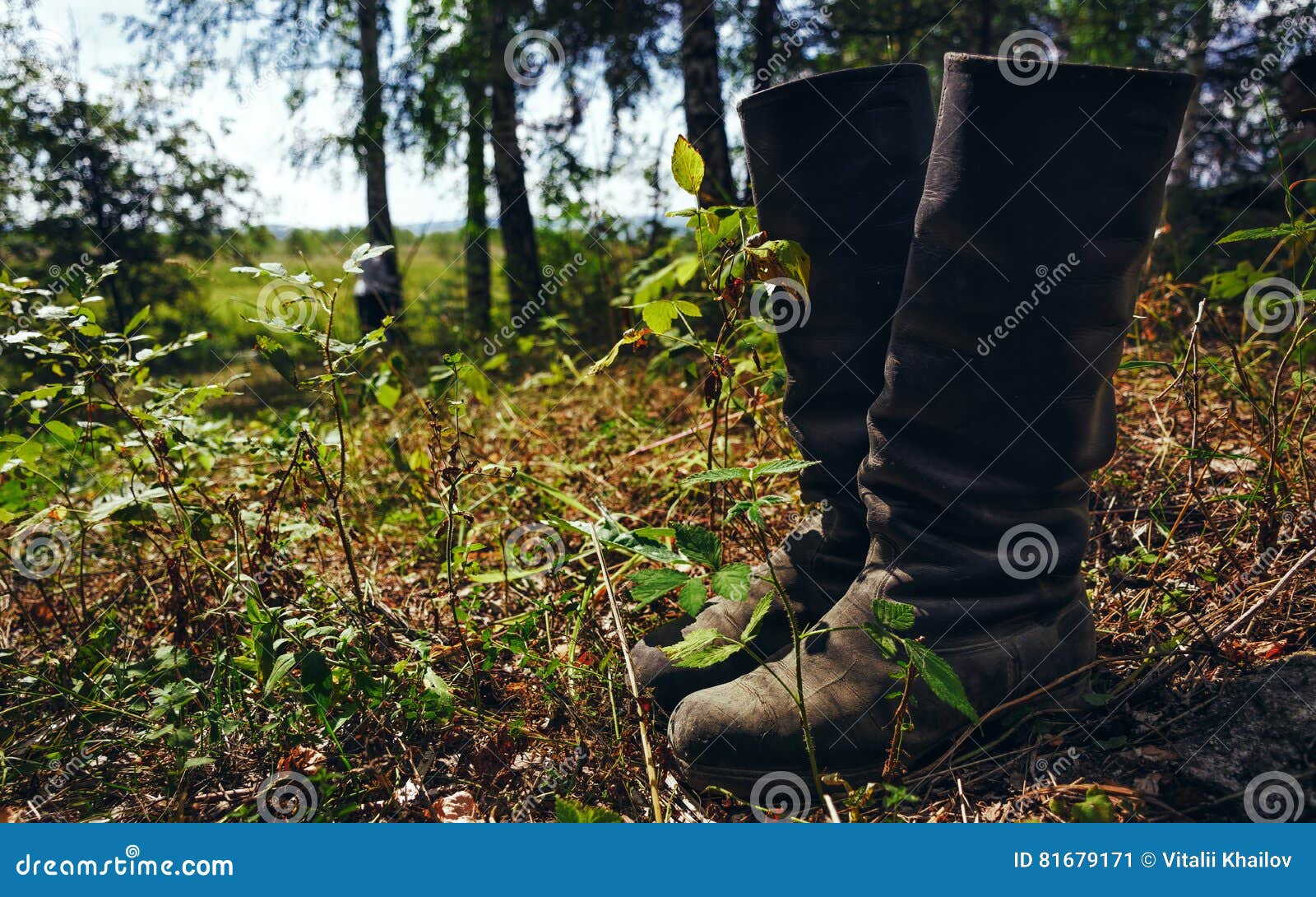 Pair of boots on the grass stock image. Image of grass - 81679171