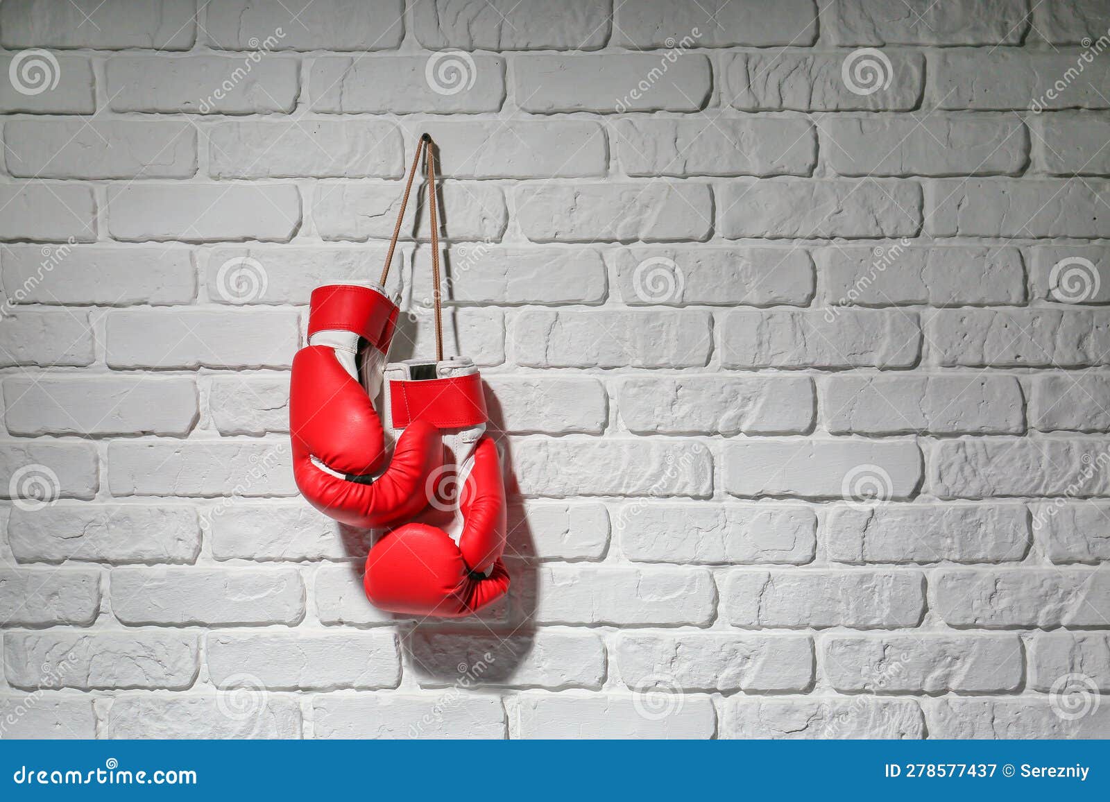 Pair of Boxing Gloves Hanging on Brick Wall Stock Image - Image of ...