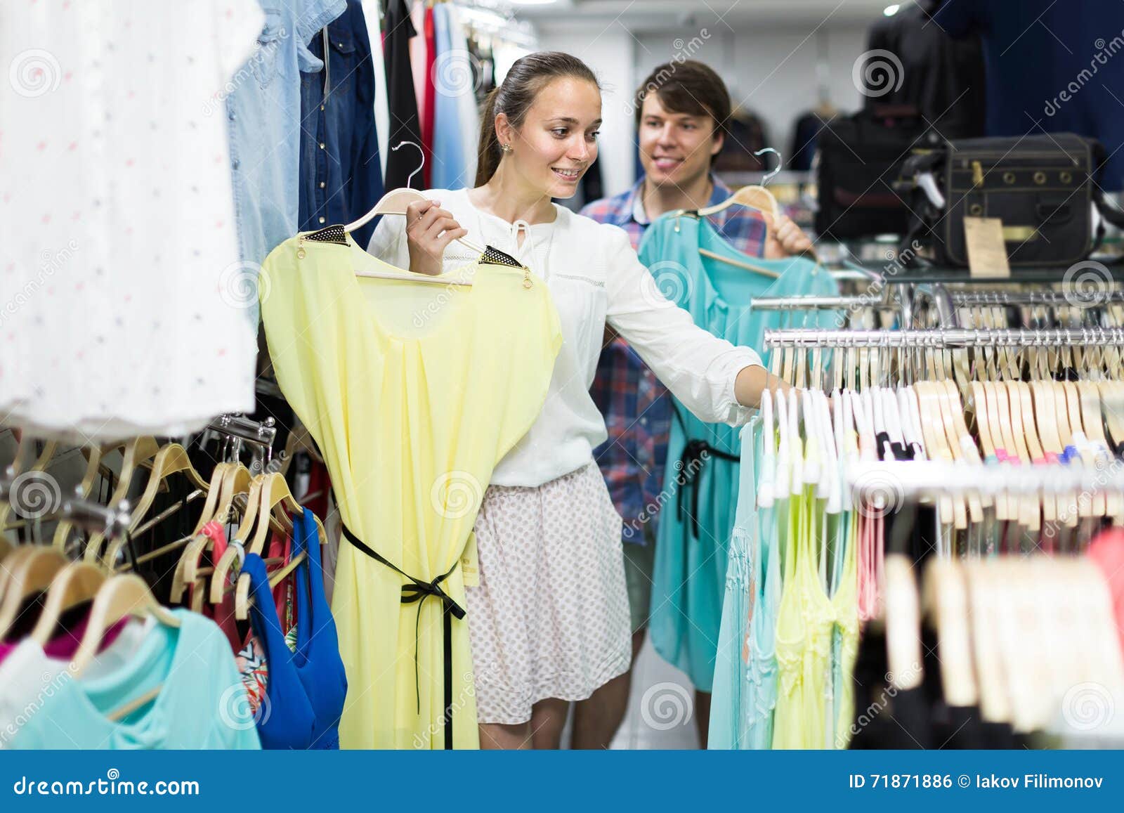 Pair Chooses Clothes at the Store Stock Photo - Image of clothing ...