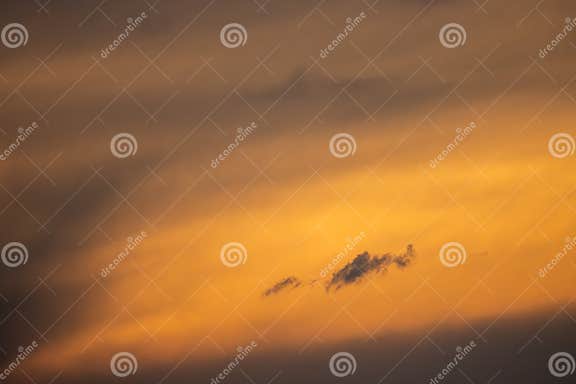 A Pair of Clouds in Front of a Storm Front at Sunset Stock Image ...