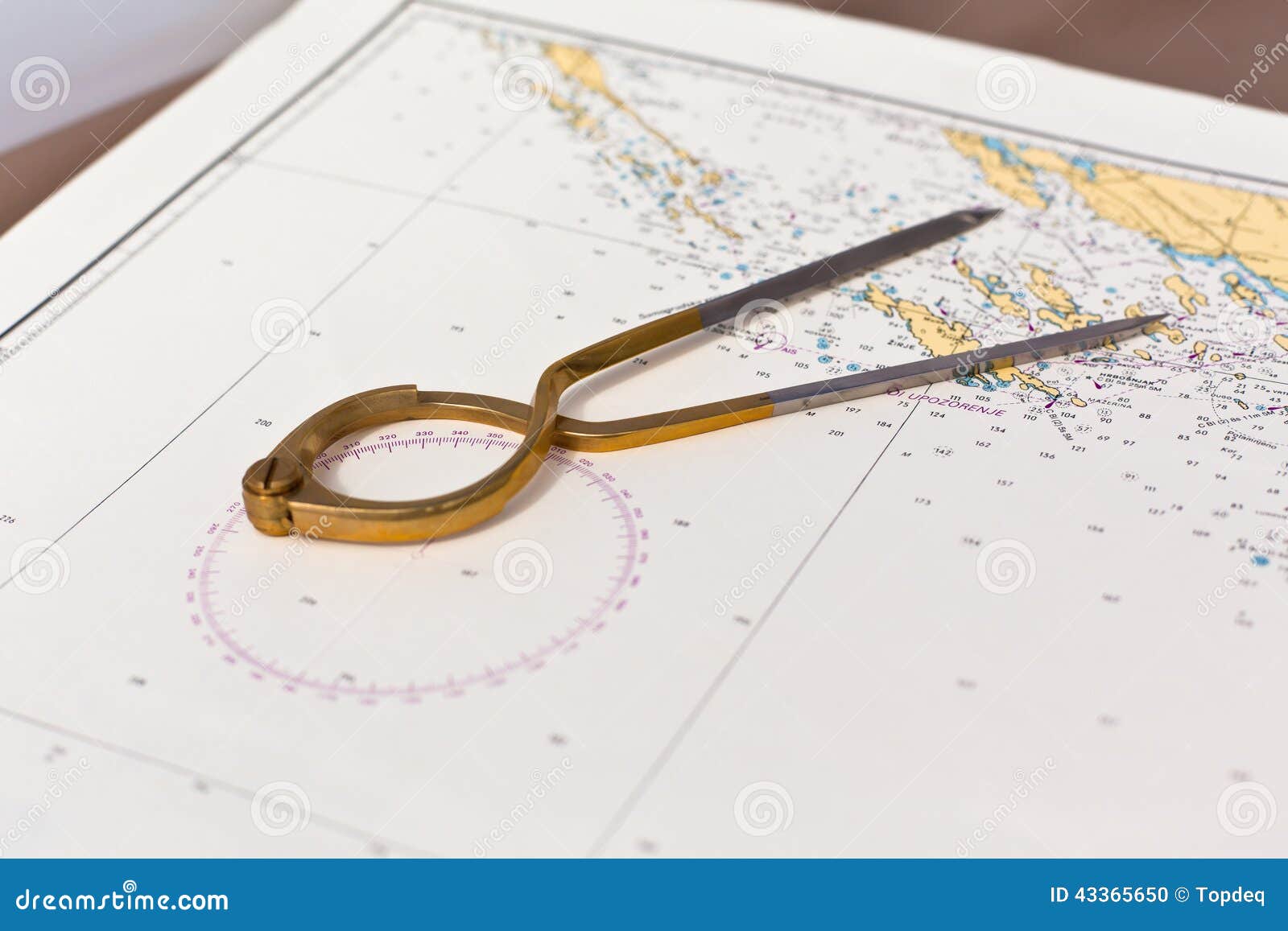 Pair of Compasses for Navigation on a Sea Map Stock Photo - Image of ...