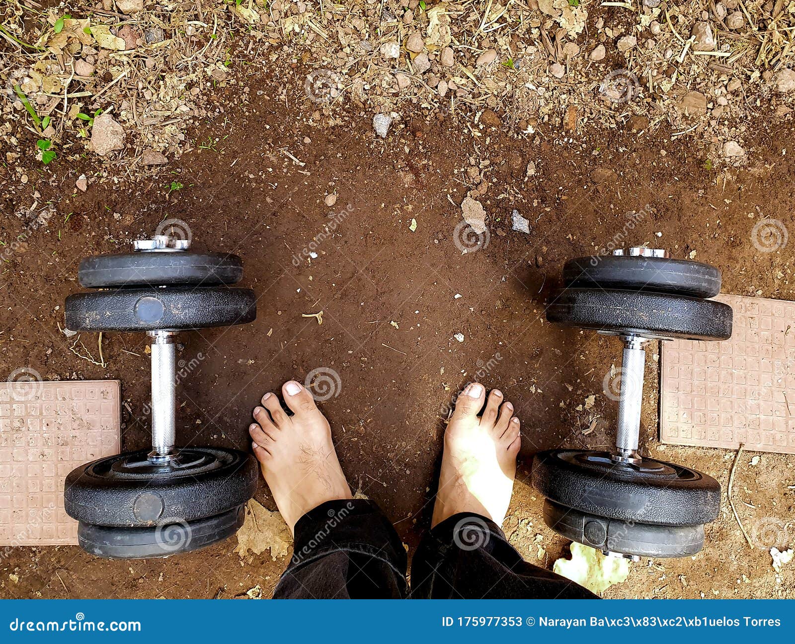 Pair of Dumbbells in Front of Men Foot, Exercise Concept Stock Image ...