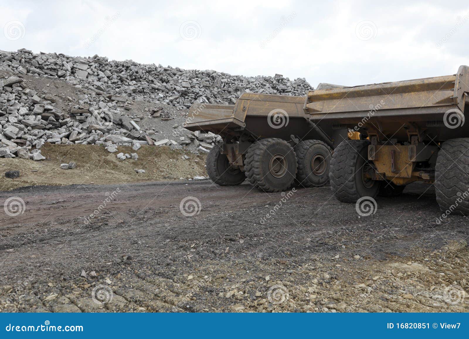 Dump Trucks Unloading Garbage Over Vast Landfill. Smoking Industrial ...