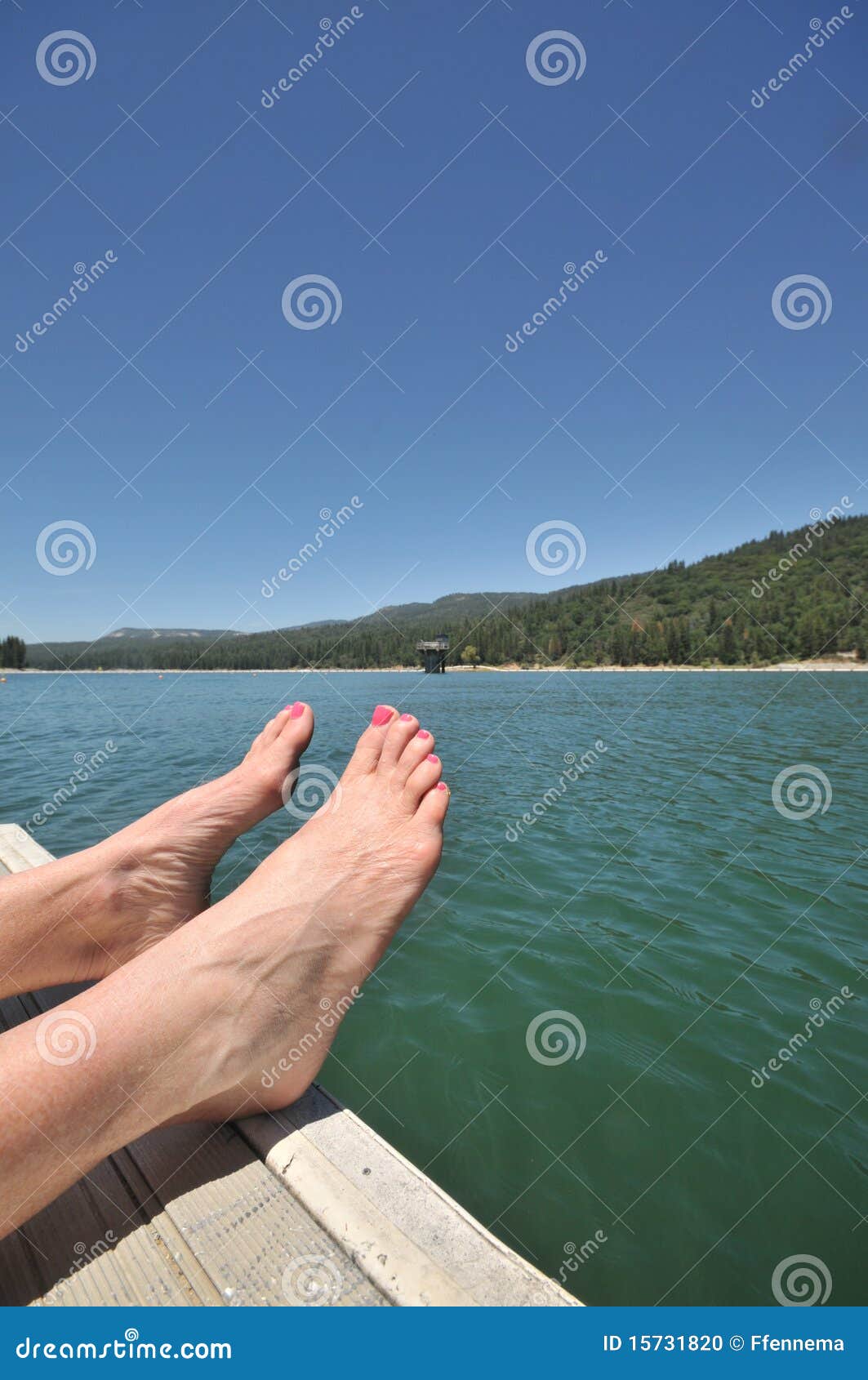 A Pair of Feet on Dock by Lake Stock Photo - Image of waiting, feet ...