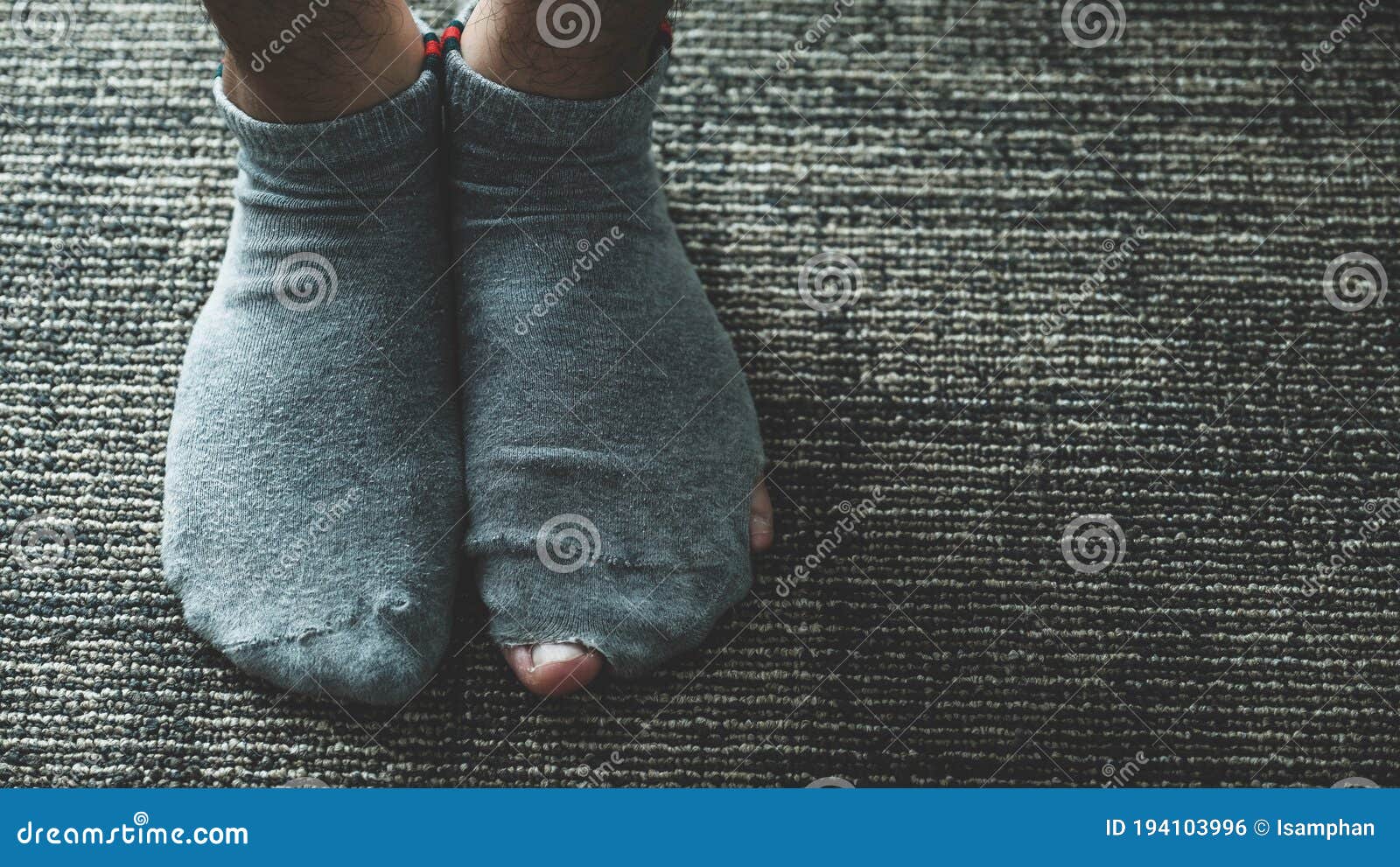 A Pair of Feet Wearing Old, Dirty, and Torn Socks Stock Photo - Image ...