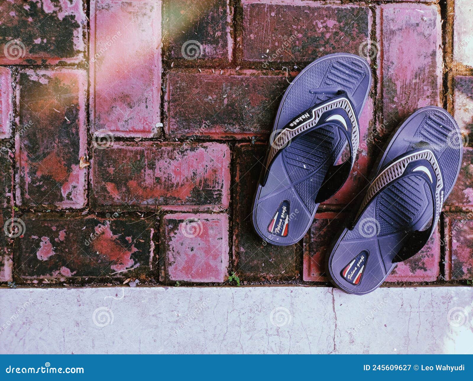 A pair of flip flops editorial photography. Image of window - 245609627