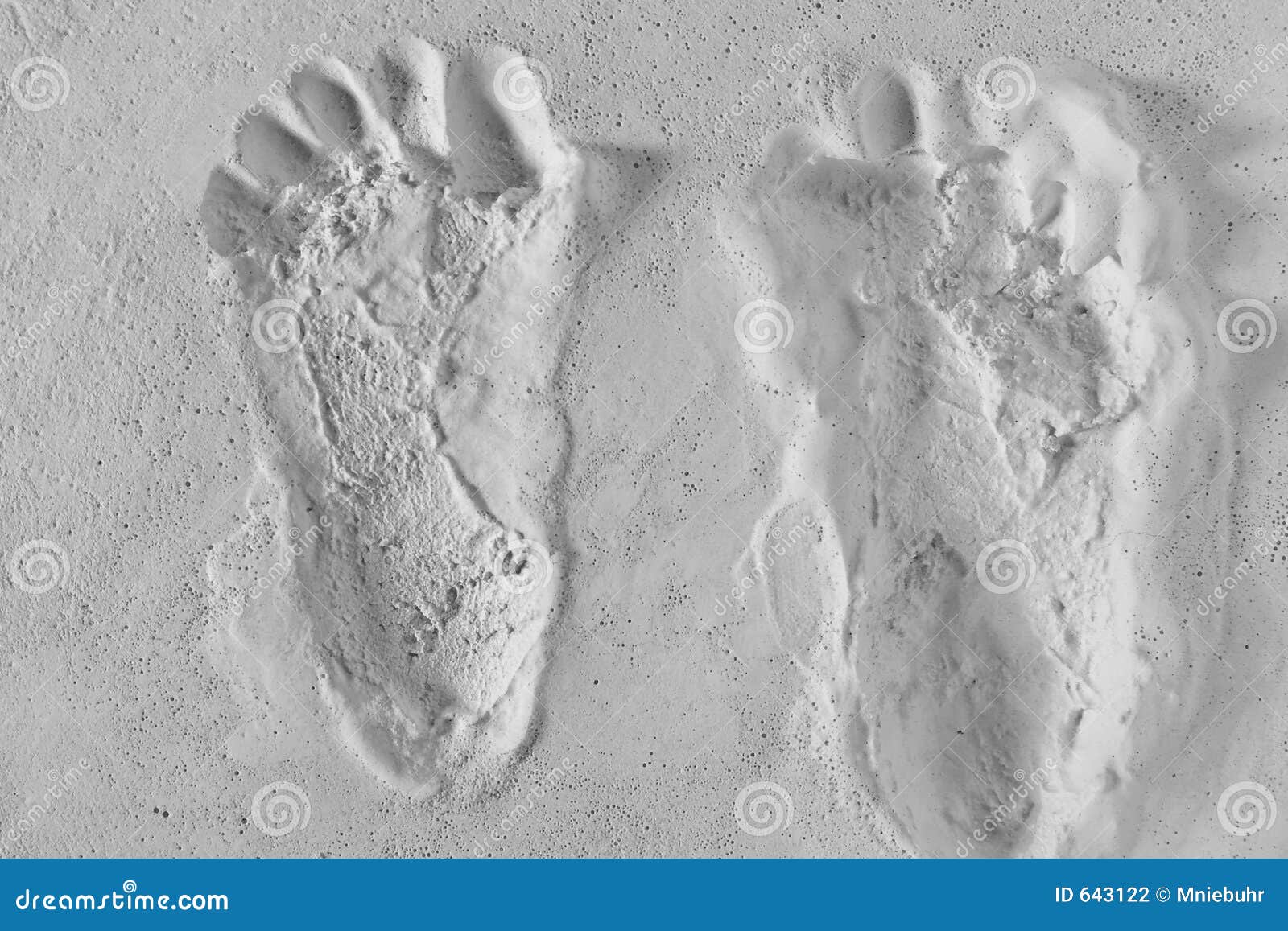 Pair of Footprints Cast in White Textured Sand Stock Photo - Image of ...
